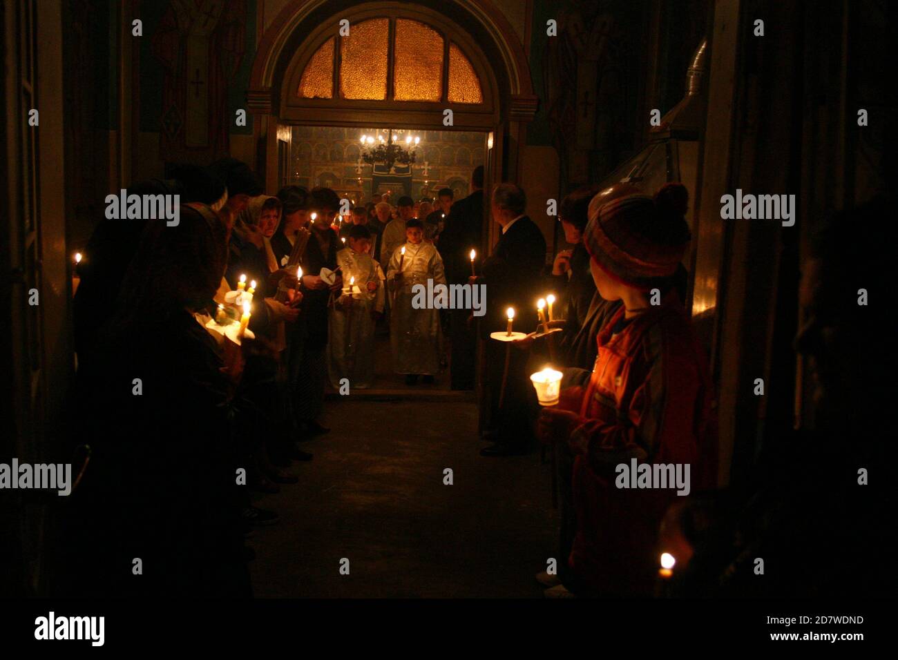 Evening Easter service at a Christian Orthodox church in Romania ...