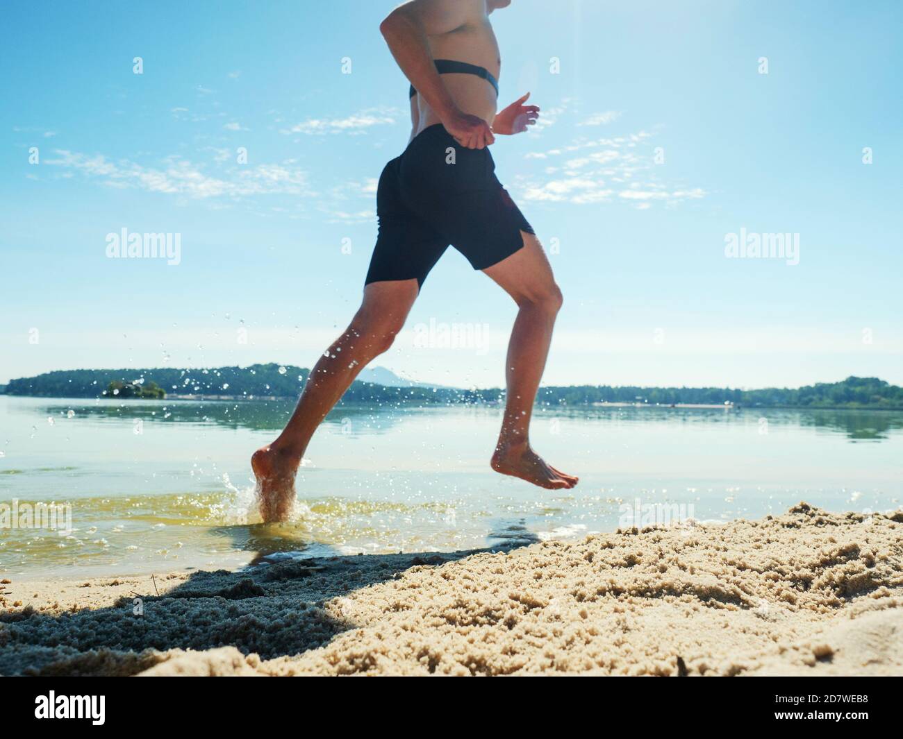 Man is running in water. Workout and training run with monitoring heart ...