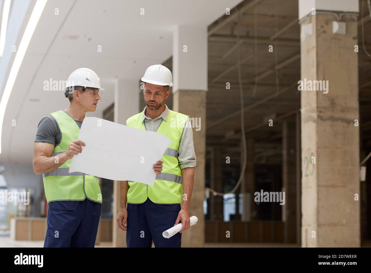Construction holding building plans hi-res stock photography and images ...