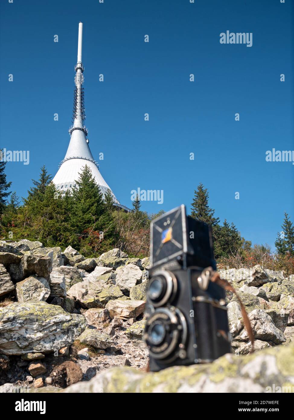 Classic vintage camera and Jested hotoel on mountain peak. Summer photo ...