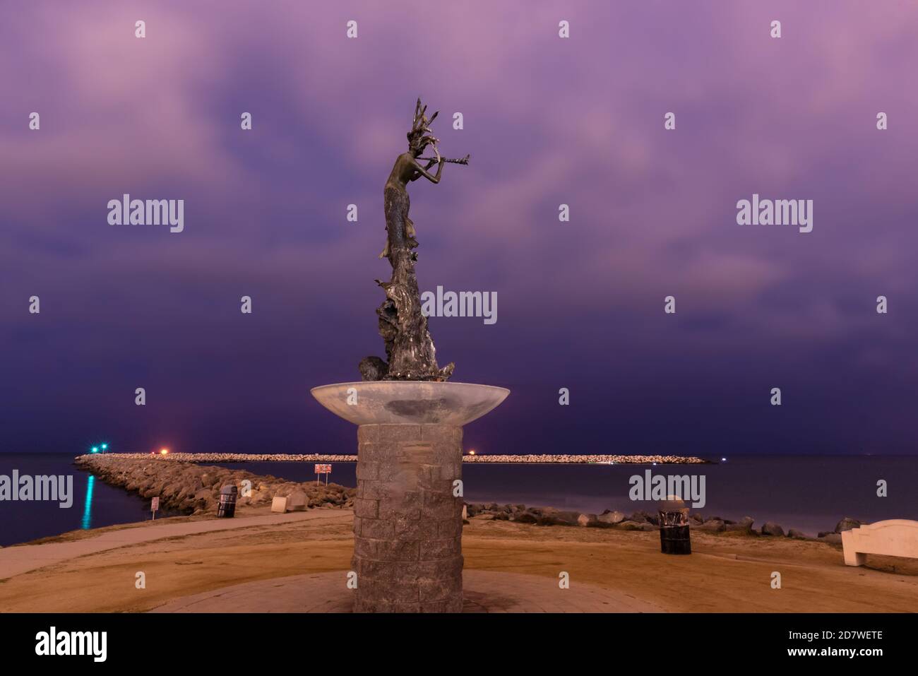 Mermaid statue beacon stands tall over harbor mouth rock jetty as ...