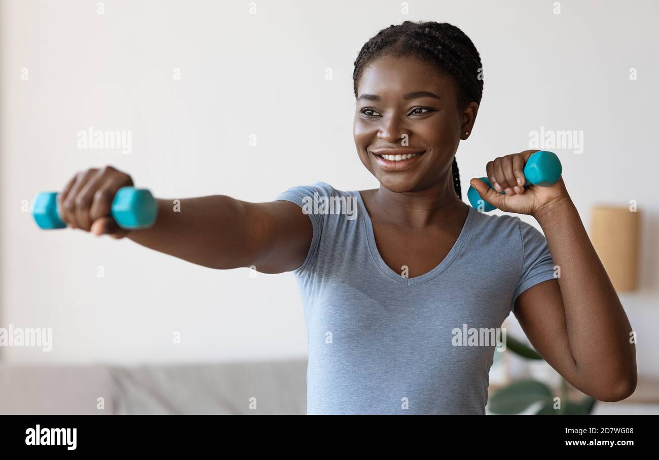 Closeup Portrait Of Sporty Black Female Doing Exercises With Dumbbells ...