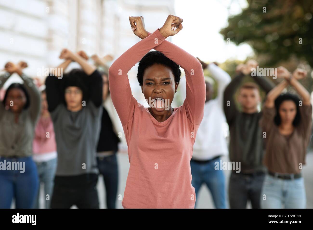 Clenched fists raised arms hi-res stock photography and images - Alamy