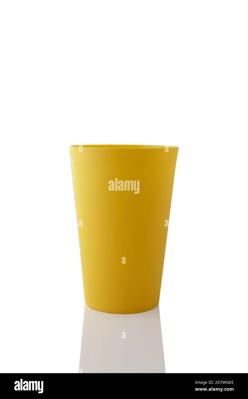 Plastic yellow cup isolated on white background Stock Photo - Alamy