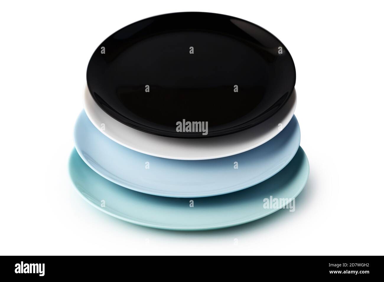 Stack of flat multi-colored set plates isolated on white background ...