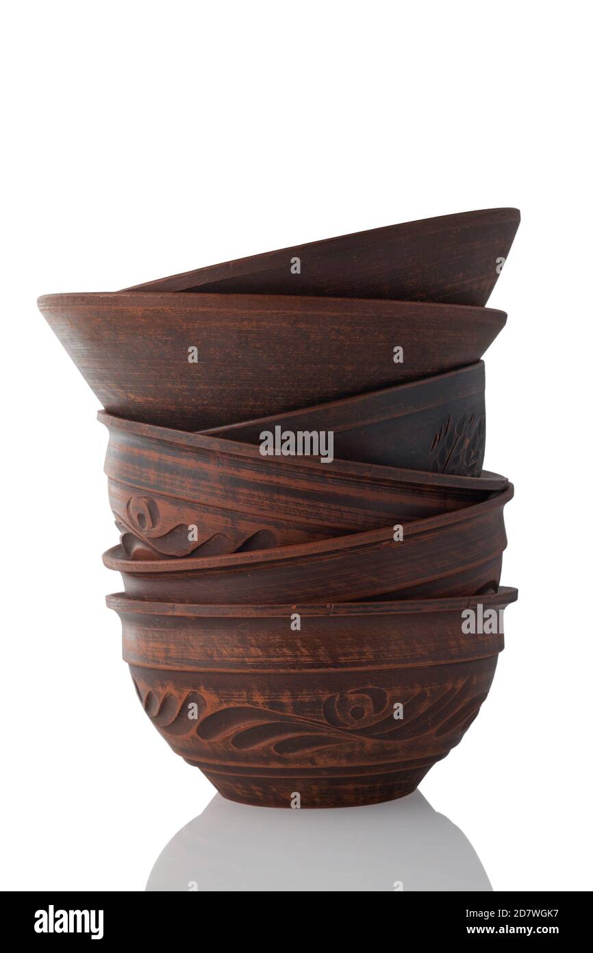 Stack of clay bowls isolated on white background Stock Photo - Alamy
