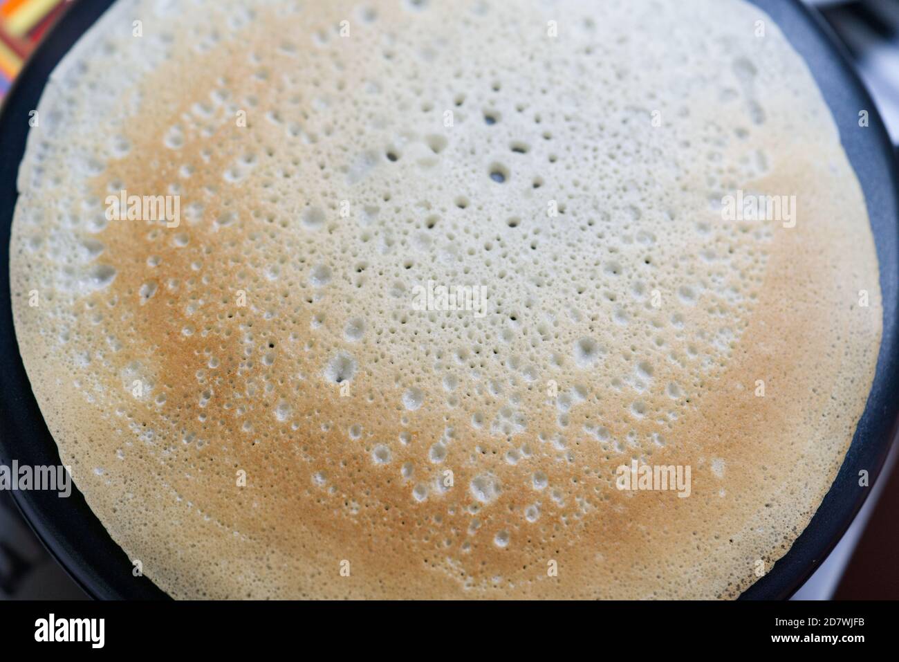 big round pancake on electric frying pan Stock Photo - Alamy