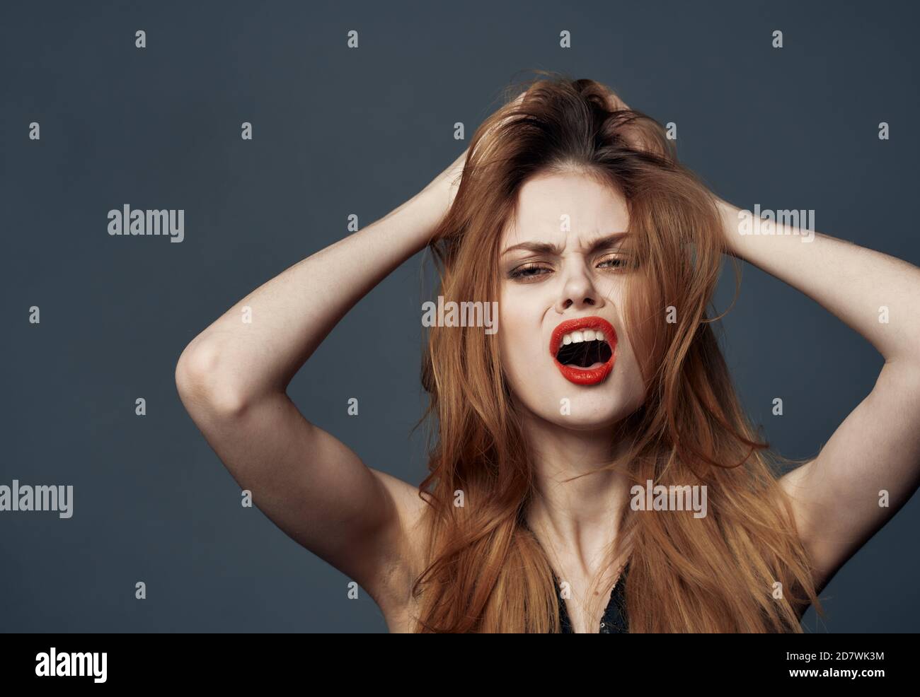 impulsive woman on a gray background indignant Look model and black ...
