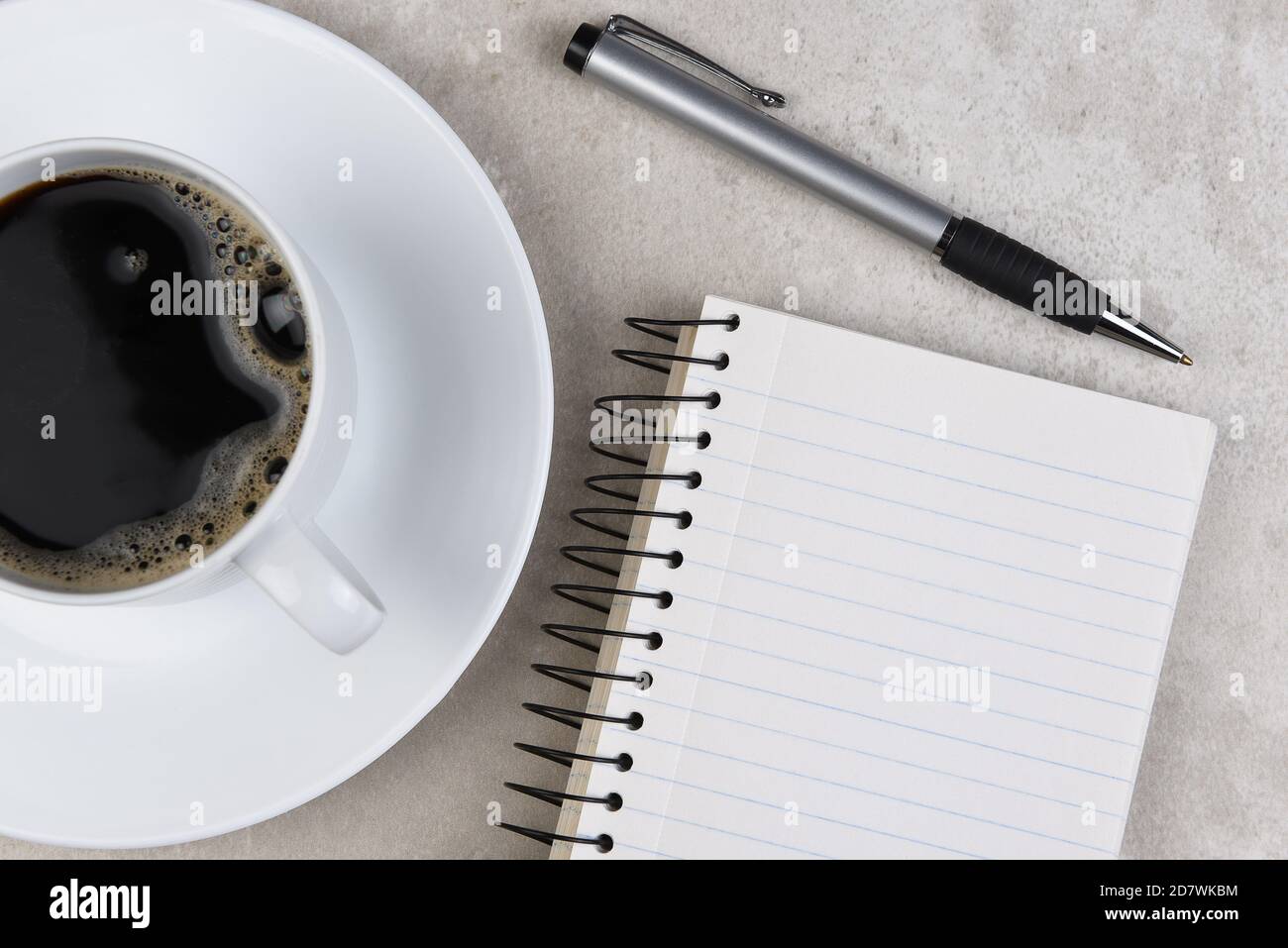 Flat Lay still life of a business desk with Coffee Cup, note book and ...