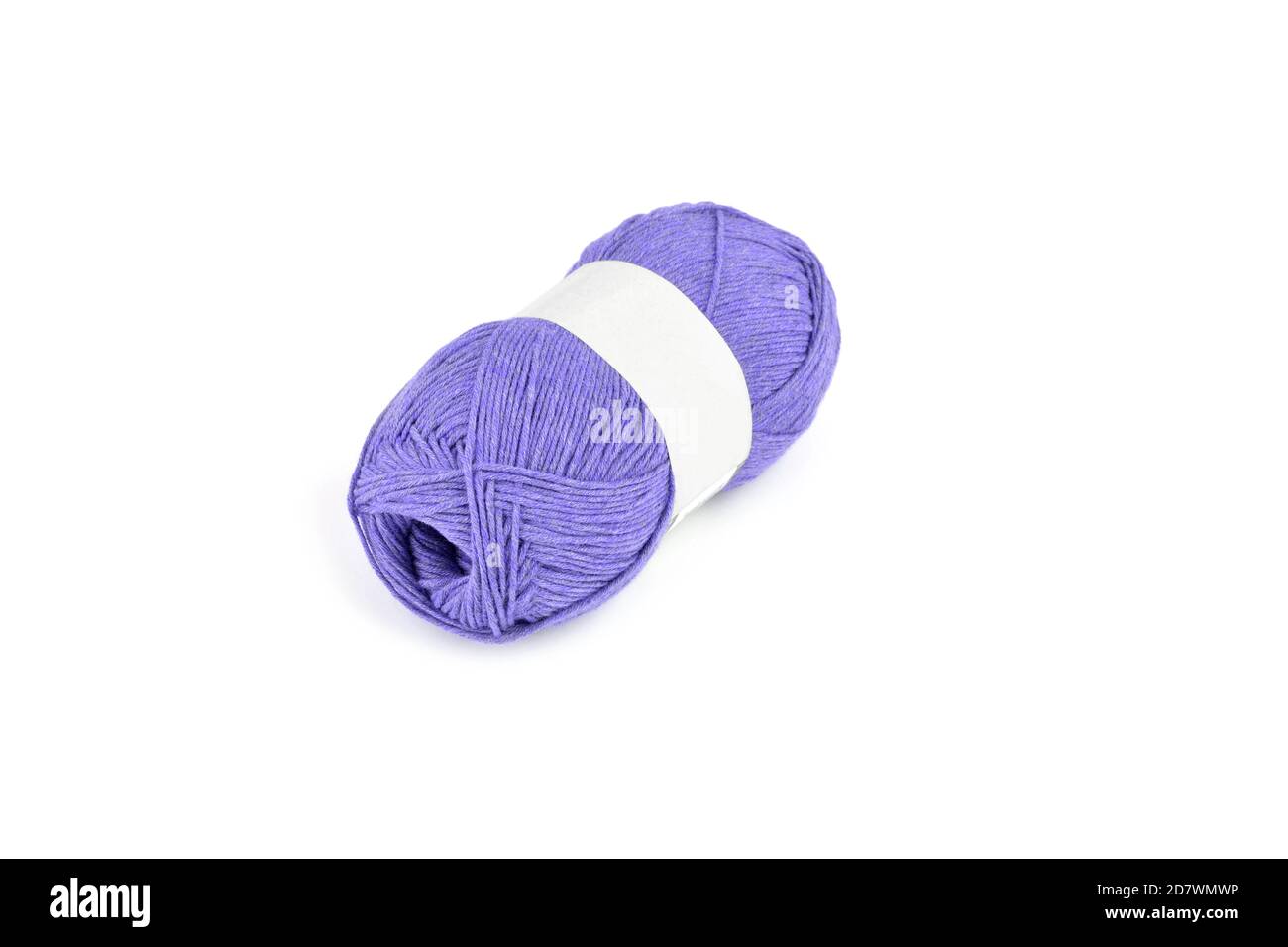 Tangle of purple color yarn with blank label on white background skein ...