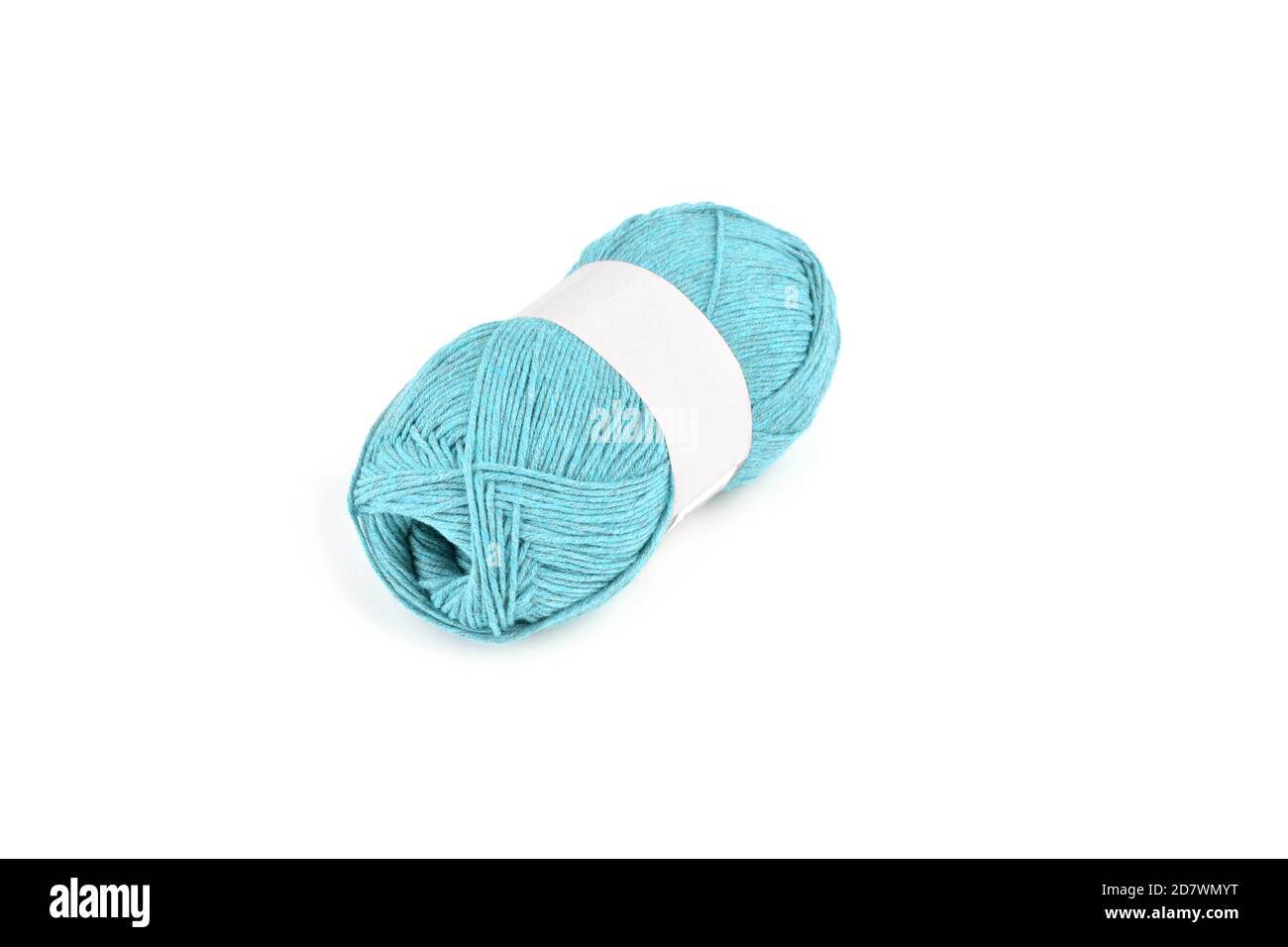 Tangle of blue color yarn with blank label on white background skein ...