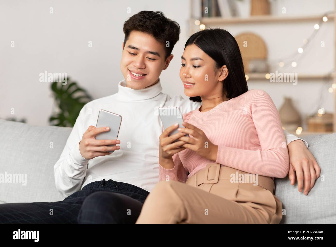 Family using mobile phones at home hi-res stock photography and images ...