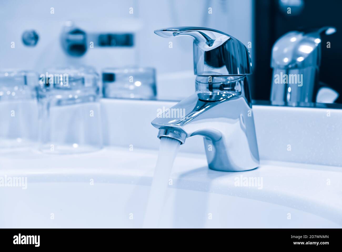 faucet and water flow on bathroom Stock Photo - Alamy