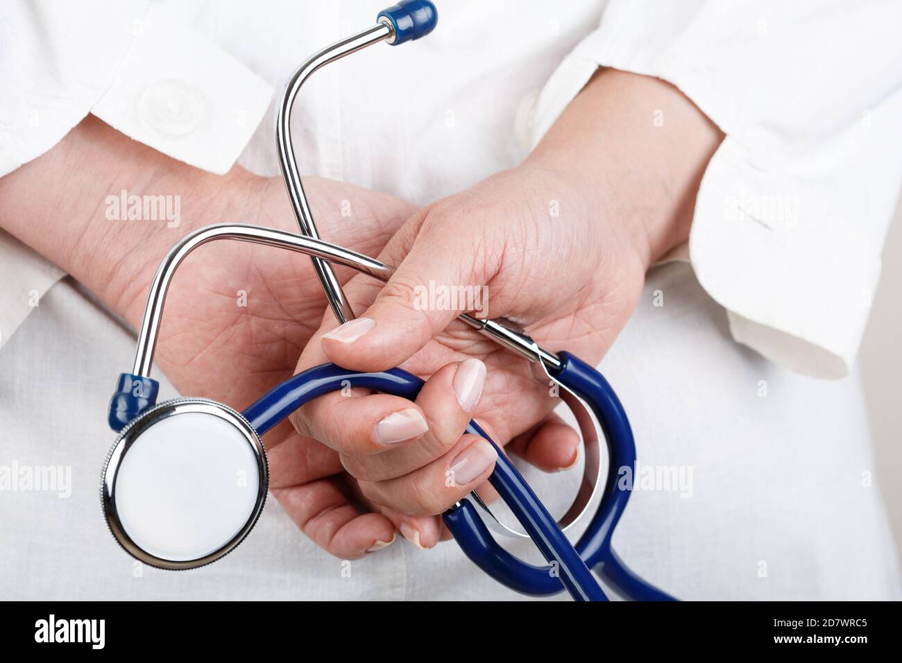 Doctor stethoscope hands crossed behind hi-res stock photography and ...