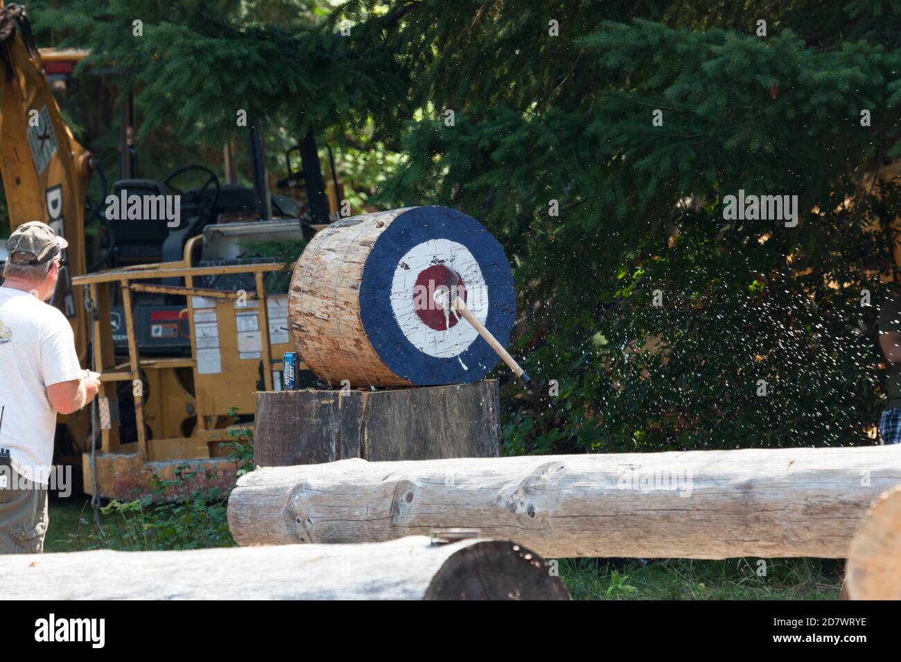 Prospect, Oregon / USA - August 16, 2014: A judge watches an axe hit ...