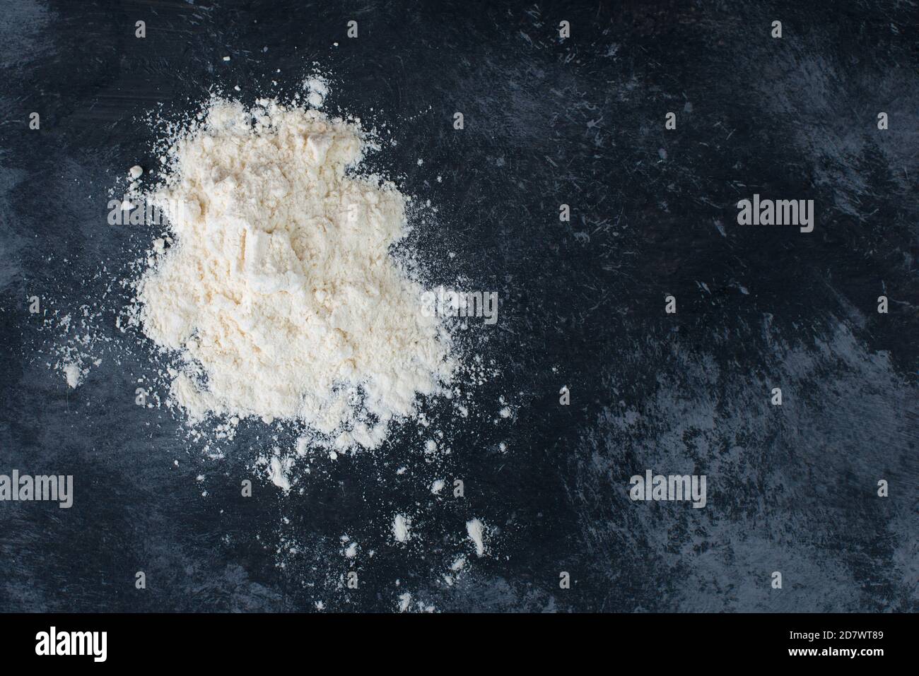 Pile of flour with a wooden shovel, empty copy space, baking ...