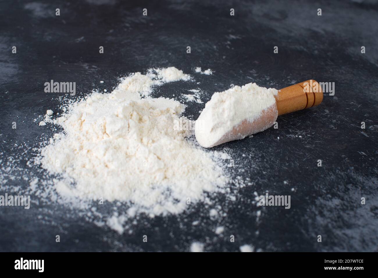 Pile of flour with a wooden shovel, empty copy space, baking ...