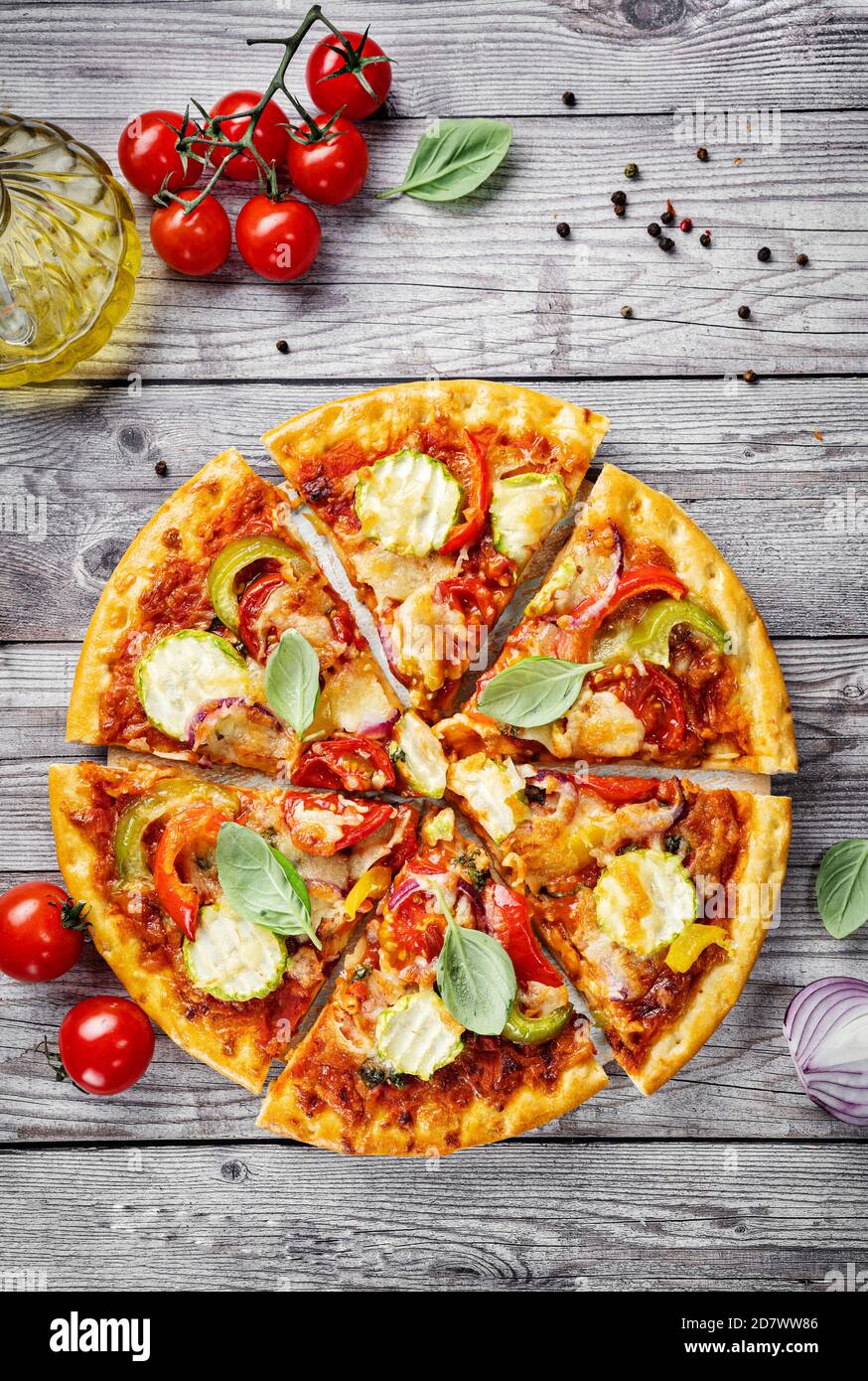 Top view of vegetarian pizza cut into slices Stock Photo - Alamy