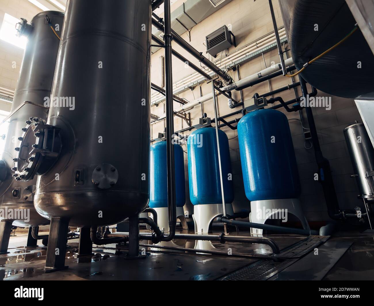 Drinking water factory production, industrial interior. Large metal ...