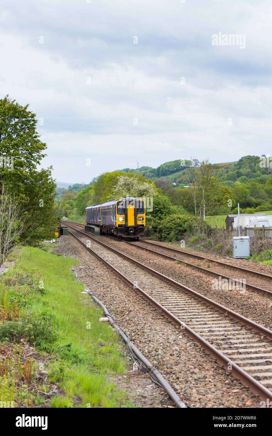 Class 153 single coach Sprinter railcar passenger train, coupled to a ...