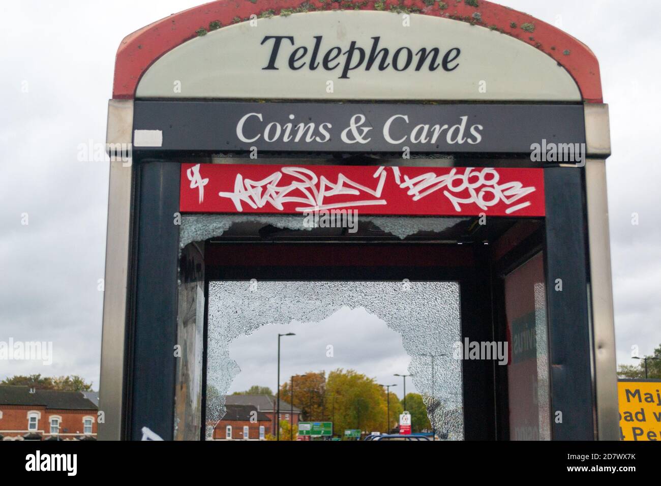 Smashed up, vandalised British telephone box with broken glass Stock ...