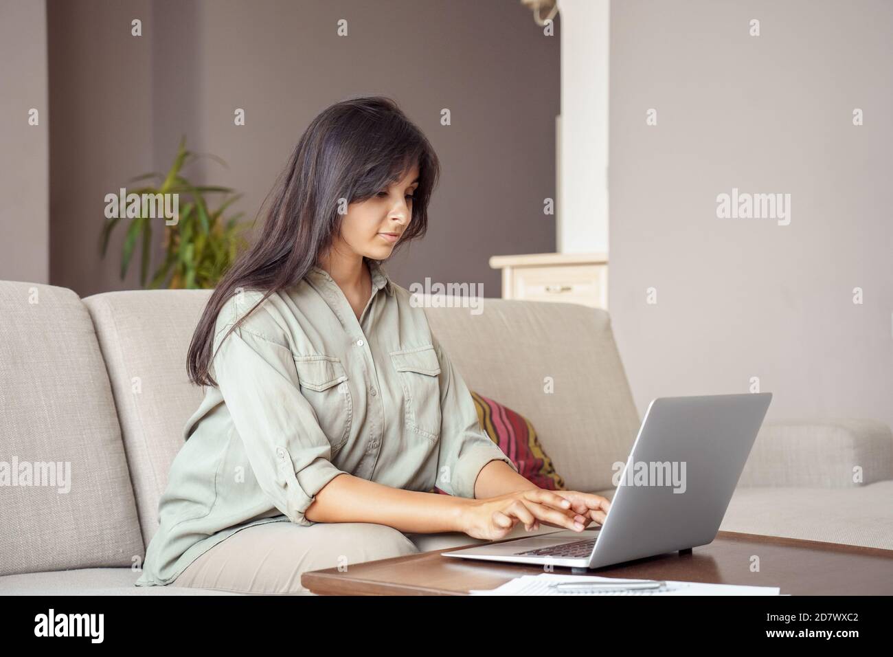 Young indian woman using laptop computer working at home office Stock ...