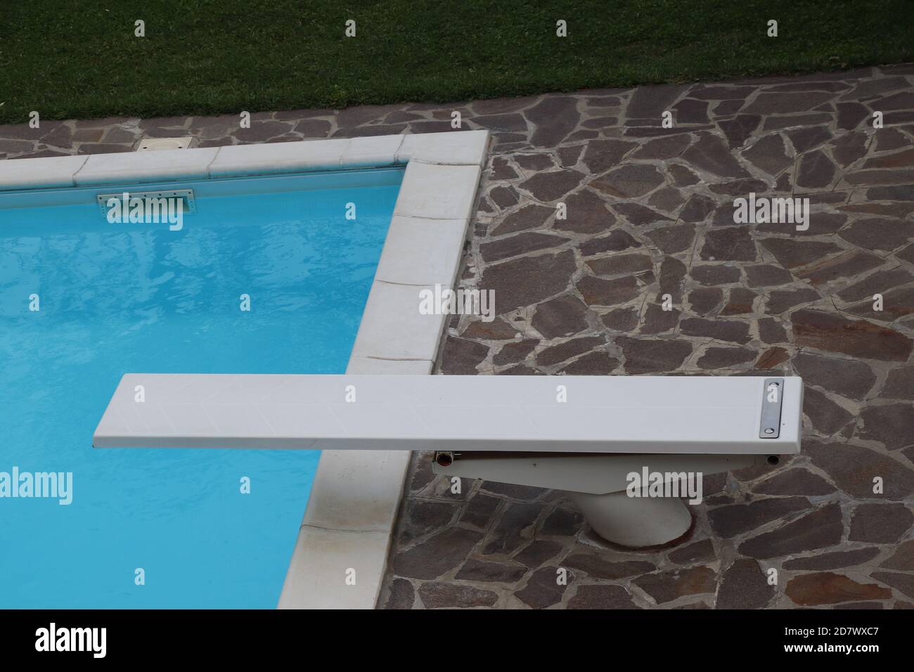Springboard at the swimming pool. It is a strong, flexible board from ...