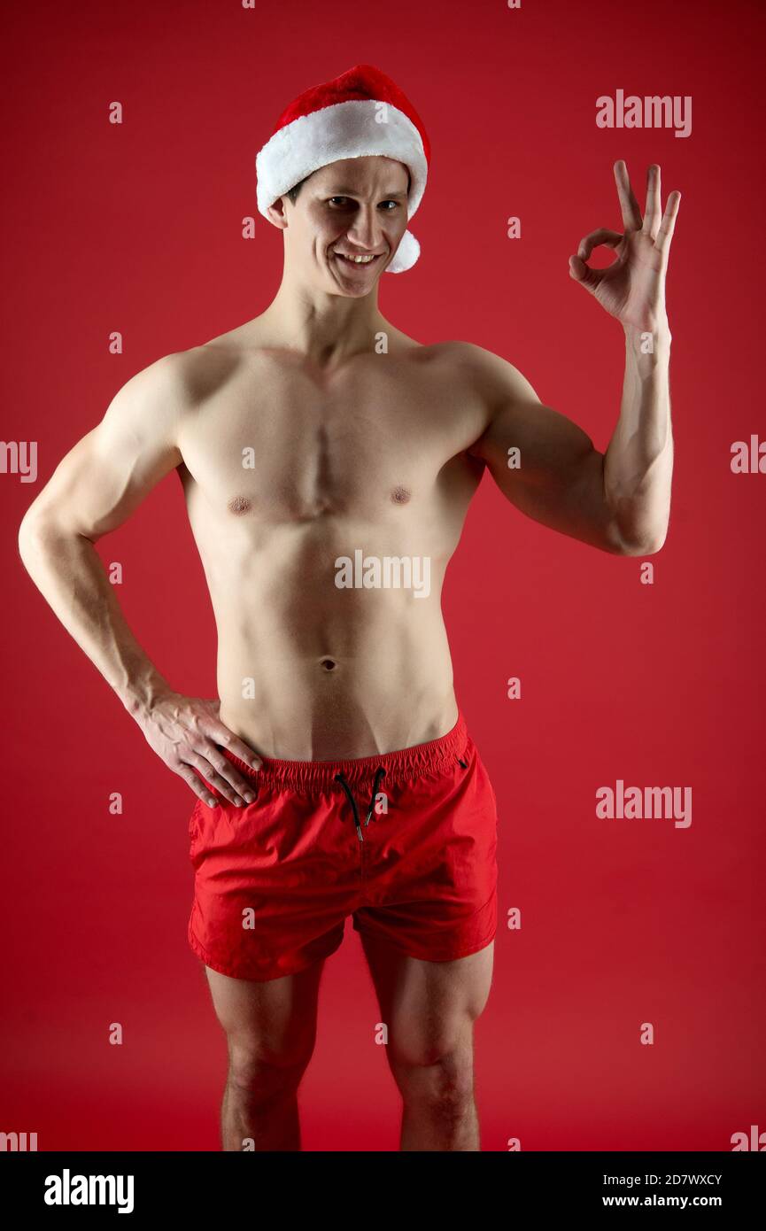 Happy Santa with muscular torso show approval OK hand sign red ...