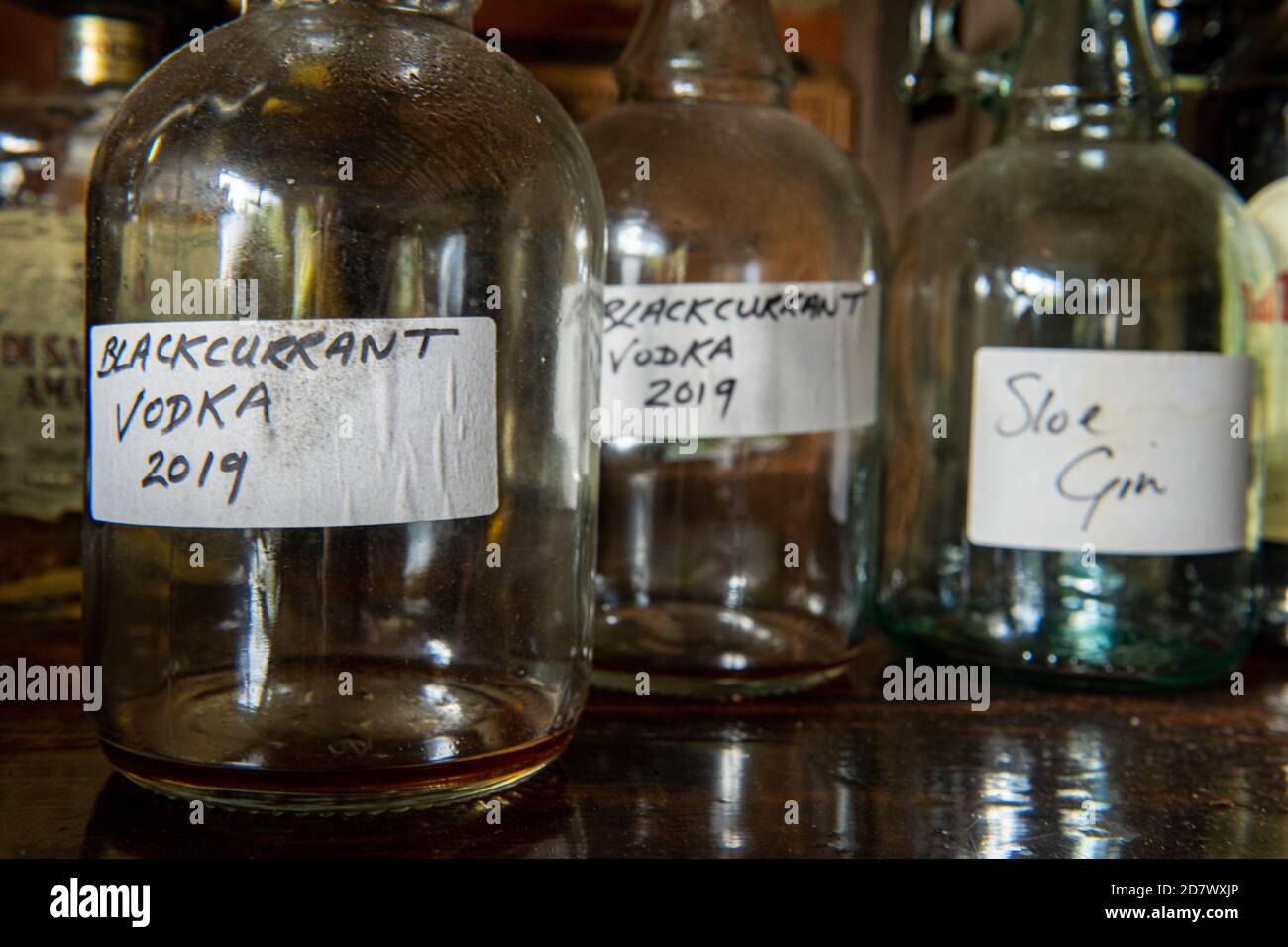 Nearly finished demijohns of home made alcoholic spirits Stock Photo ...