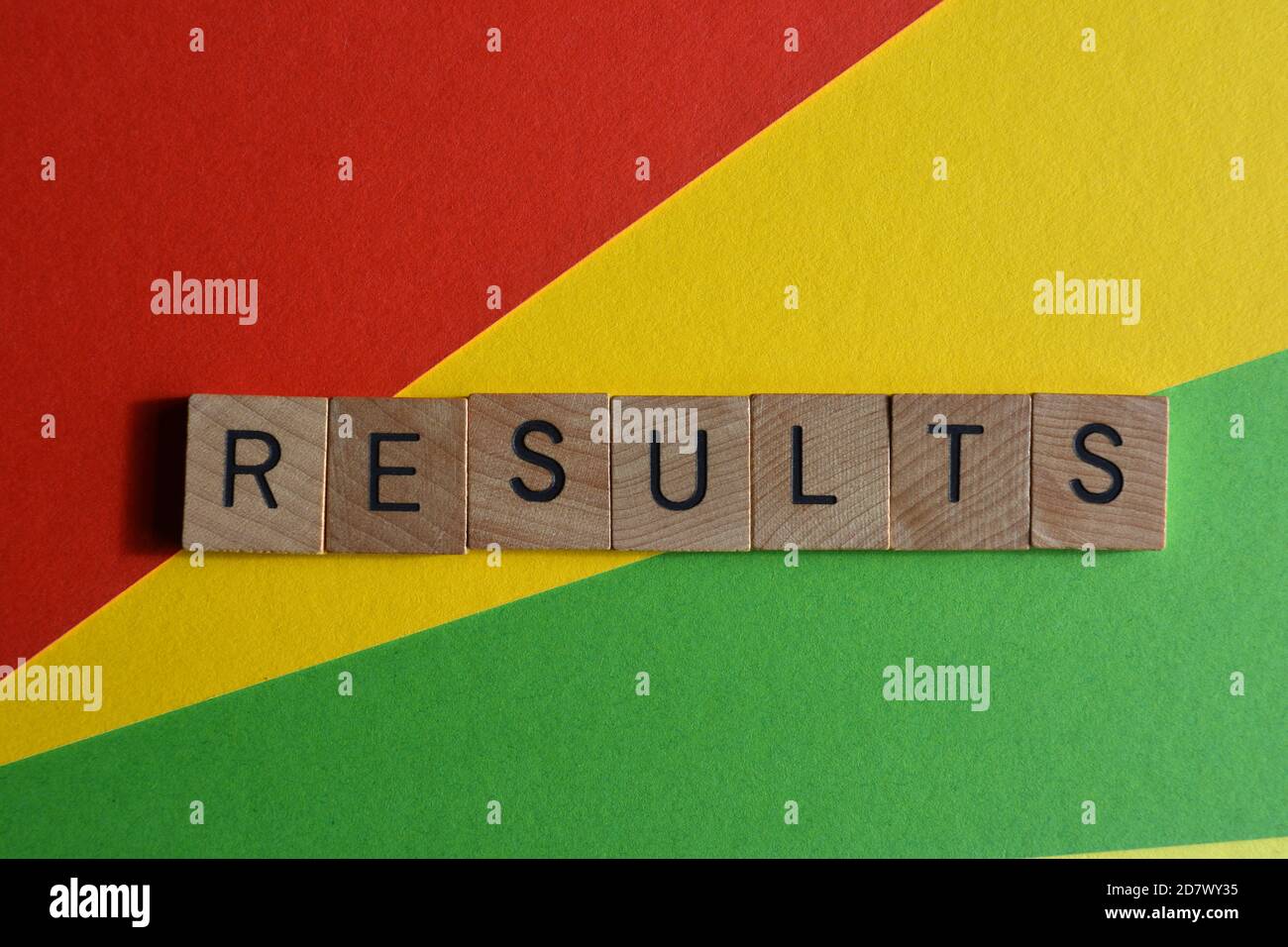 Results, word in wooden alphabet letters isolated on colourful ...