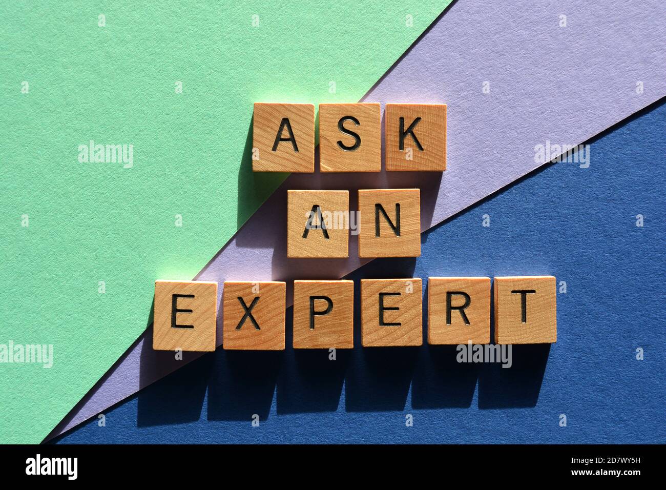 Ask An Expert, words in wood alphabet letters isolated on colorful ...