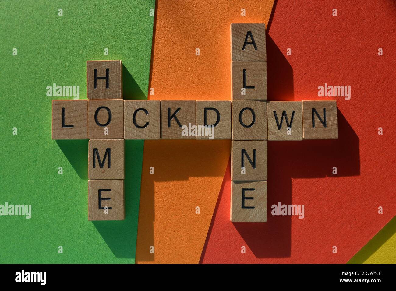 Home, Alone, Lockdown, words in wood alphabet letters in crossword form ...