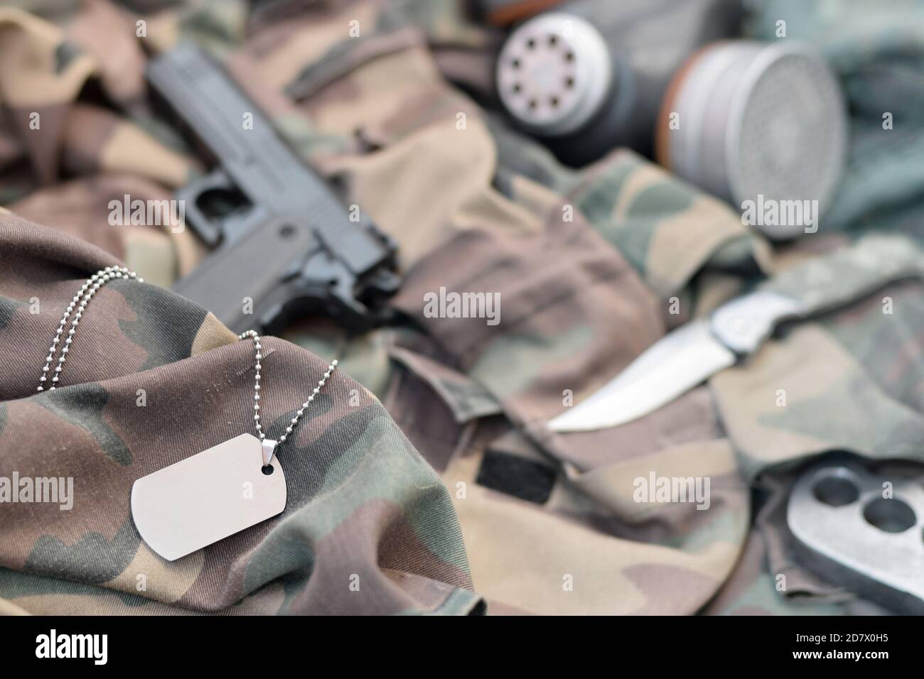 Stalker soldiers soviet gas mask lies with handgun and knife on green ...