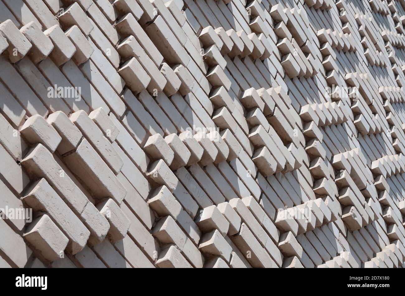 A pattern made of white bricks in the form of diamond shapes ...