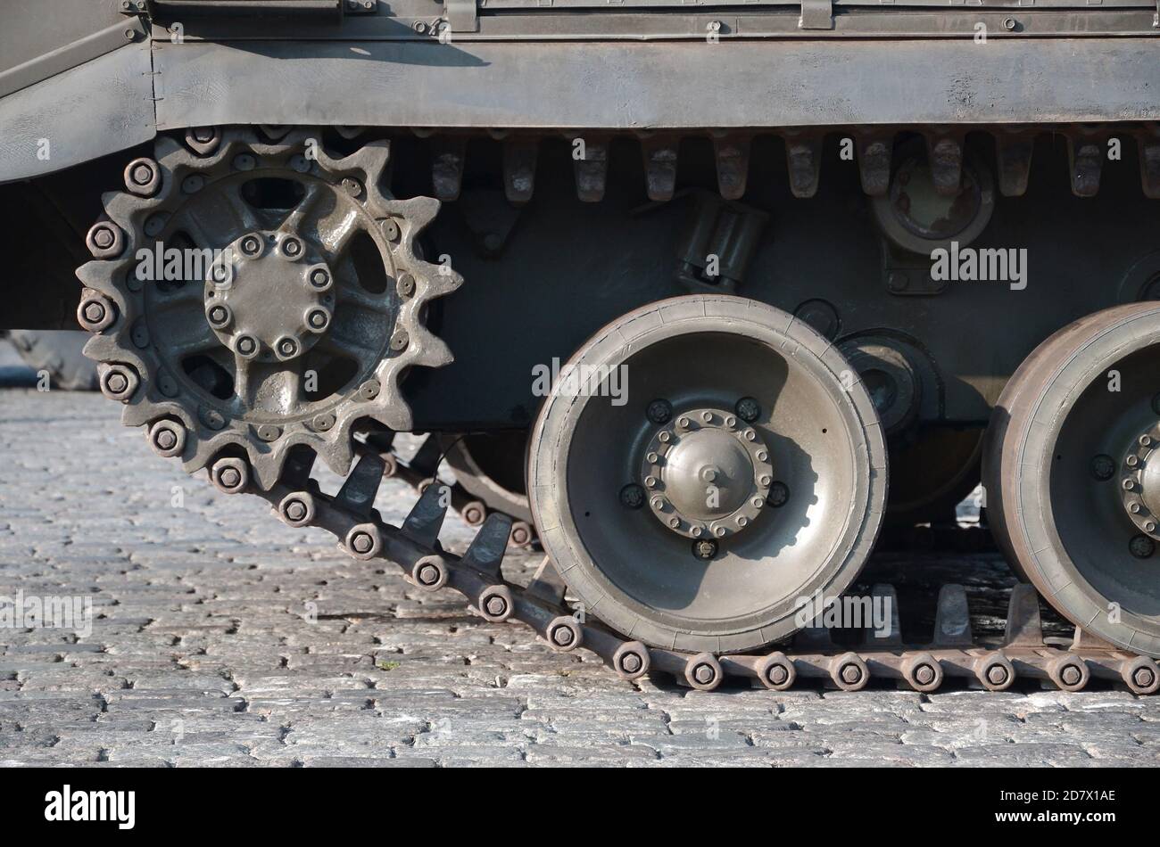 Close up view of green armoured caterpillar transport. Modern military ...