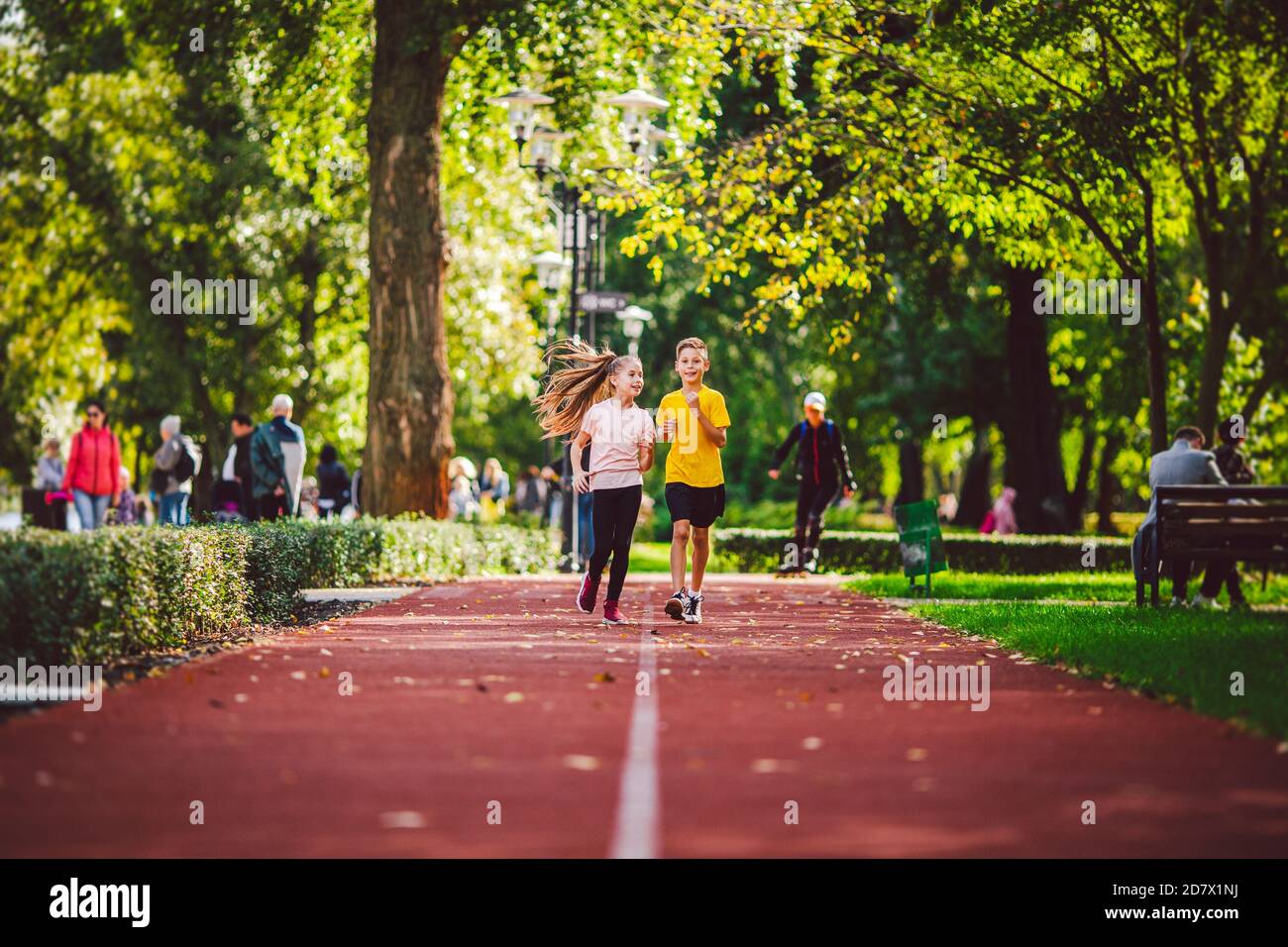 Child fitness, twins kids running on stadium track in city park ...