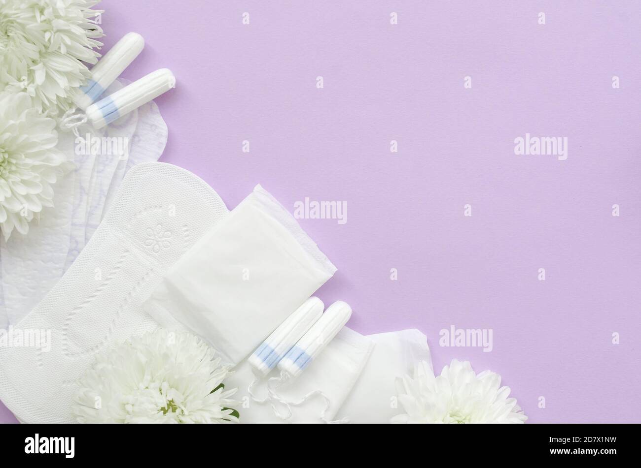 Menstrual pads and tampons with tender white flowers on pastel lilac ...