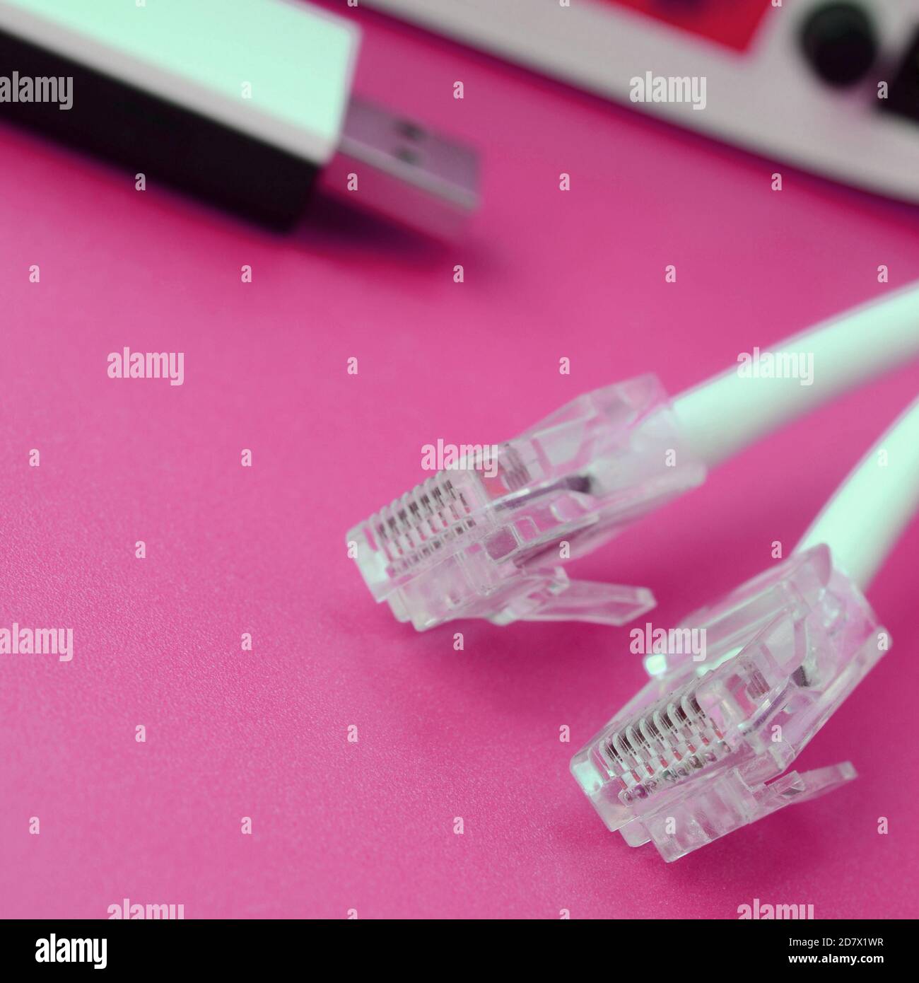 Internet Router Portable Usb Wi Fi Adapter And Internet Cable Plugs Lie On A Bright Pink