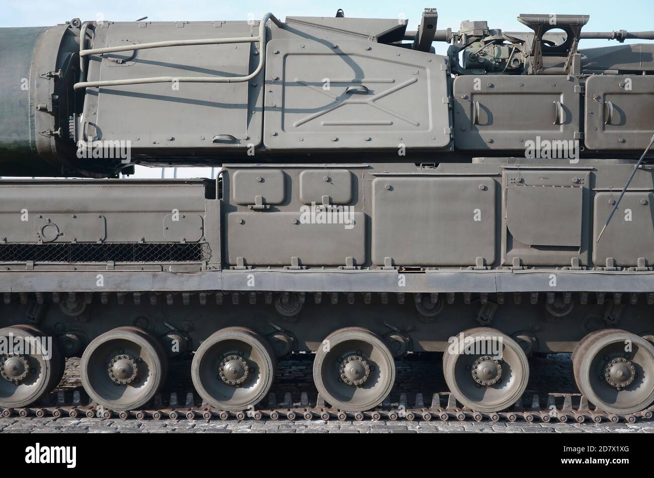 Close up view of green armoured caterpillar transport. Modern military ...
