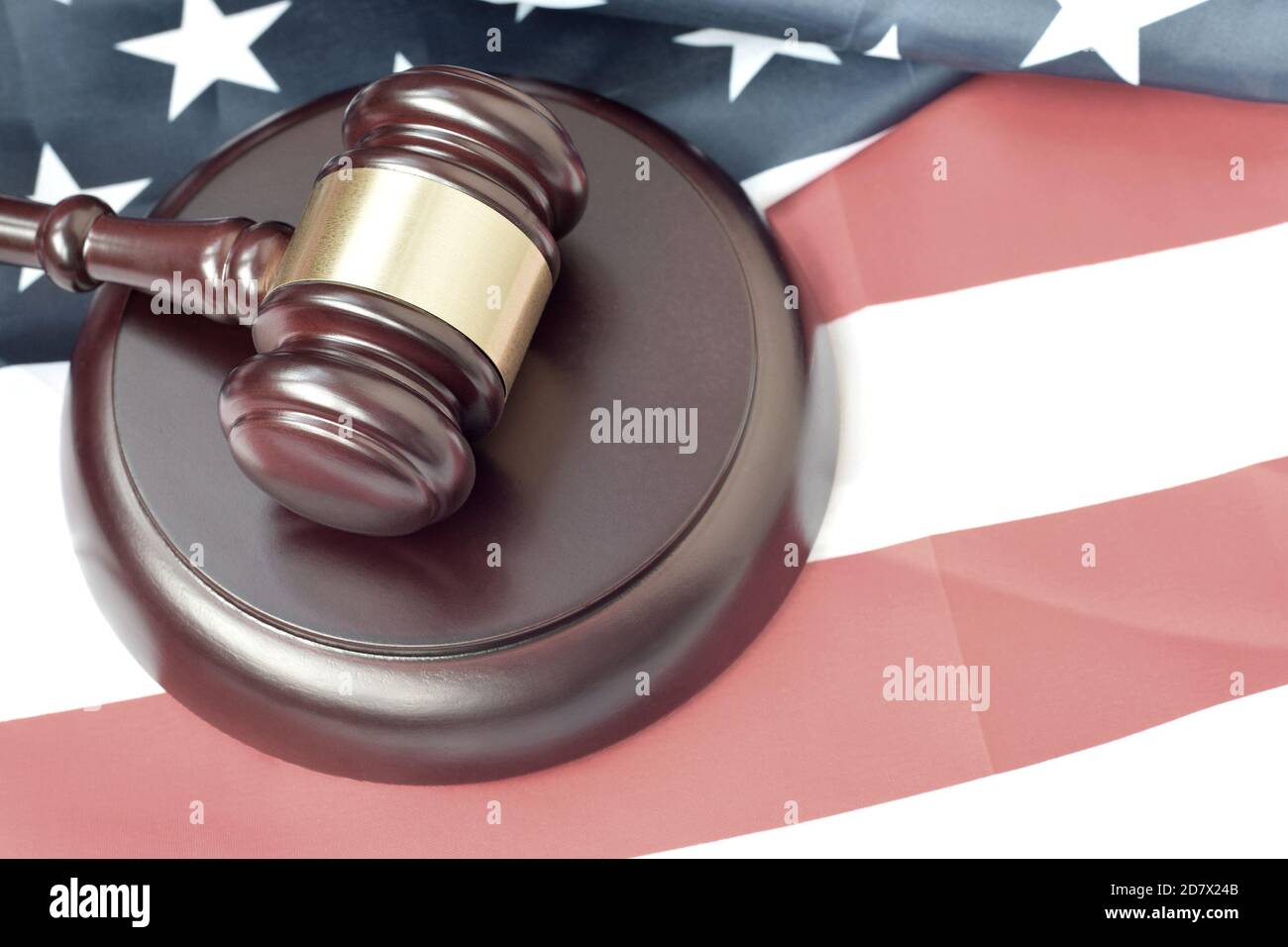 Justice mallet on United States flag in a courtroom during a judicial ...