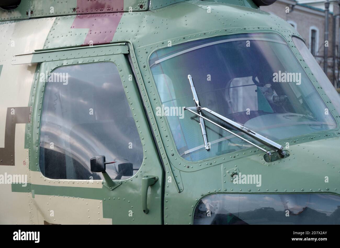 Close up view on helicopter cabin fragment. Camouflage aircraft ...
