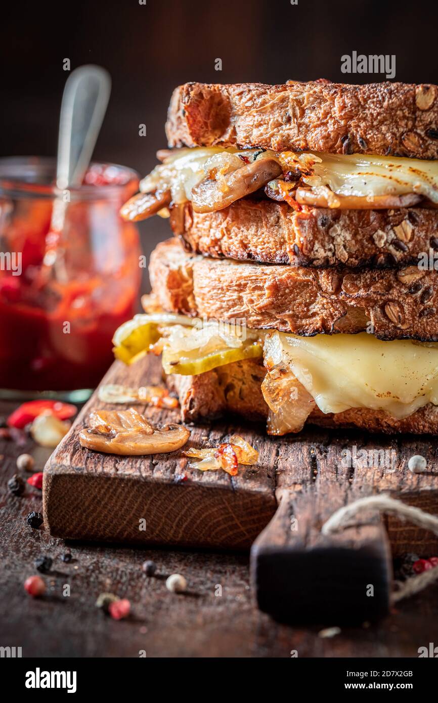 Homemade Toast with mushrooms, cheese and onion served with bbq sauce ...