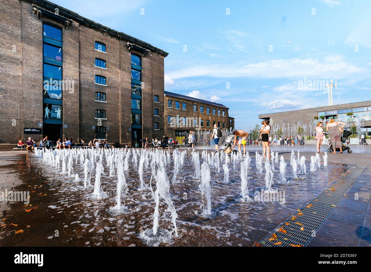 King's Cross London, UK, July 12, 2019: Granary Square People enjoy ...
