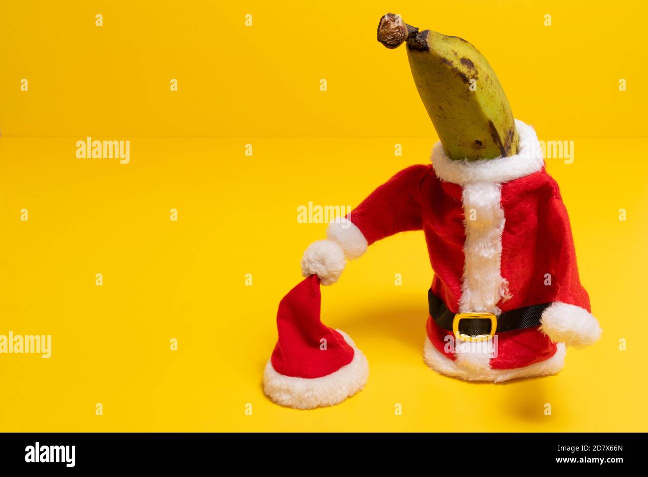 Banana dressed as Santa Claus, prepared for Christmas Stock Photo - Alamy