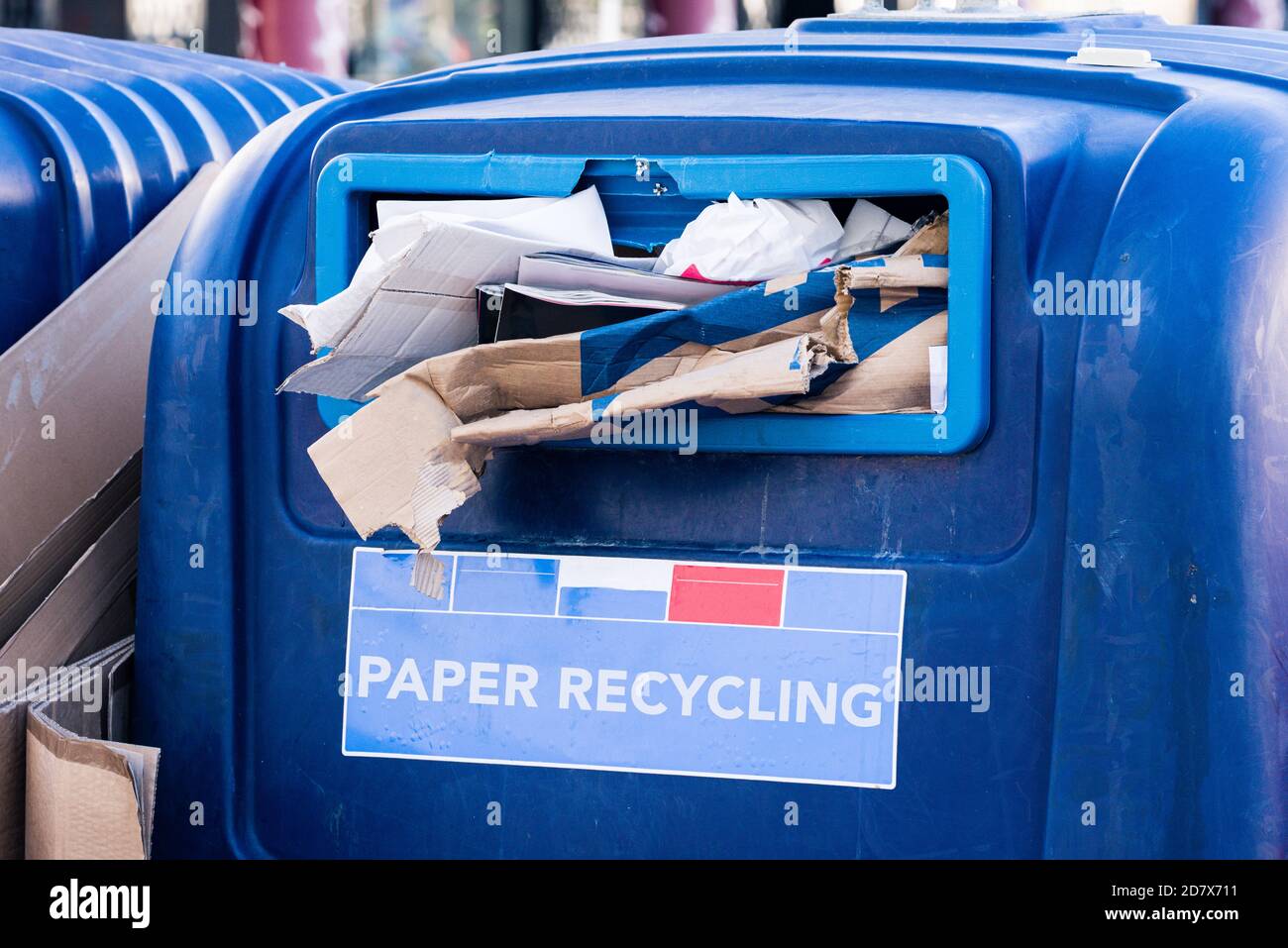 Paper and cardboard recycling. Public container full of paper and ...