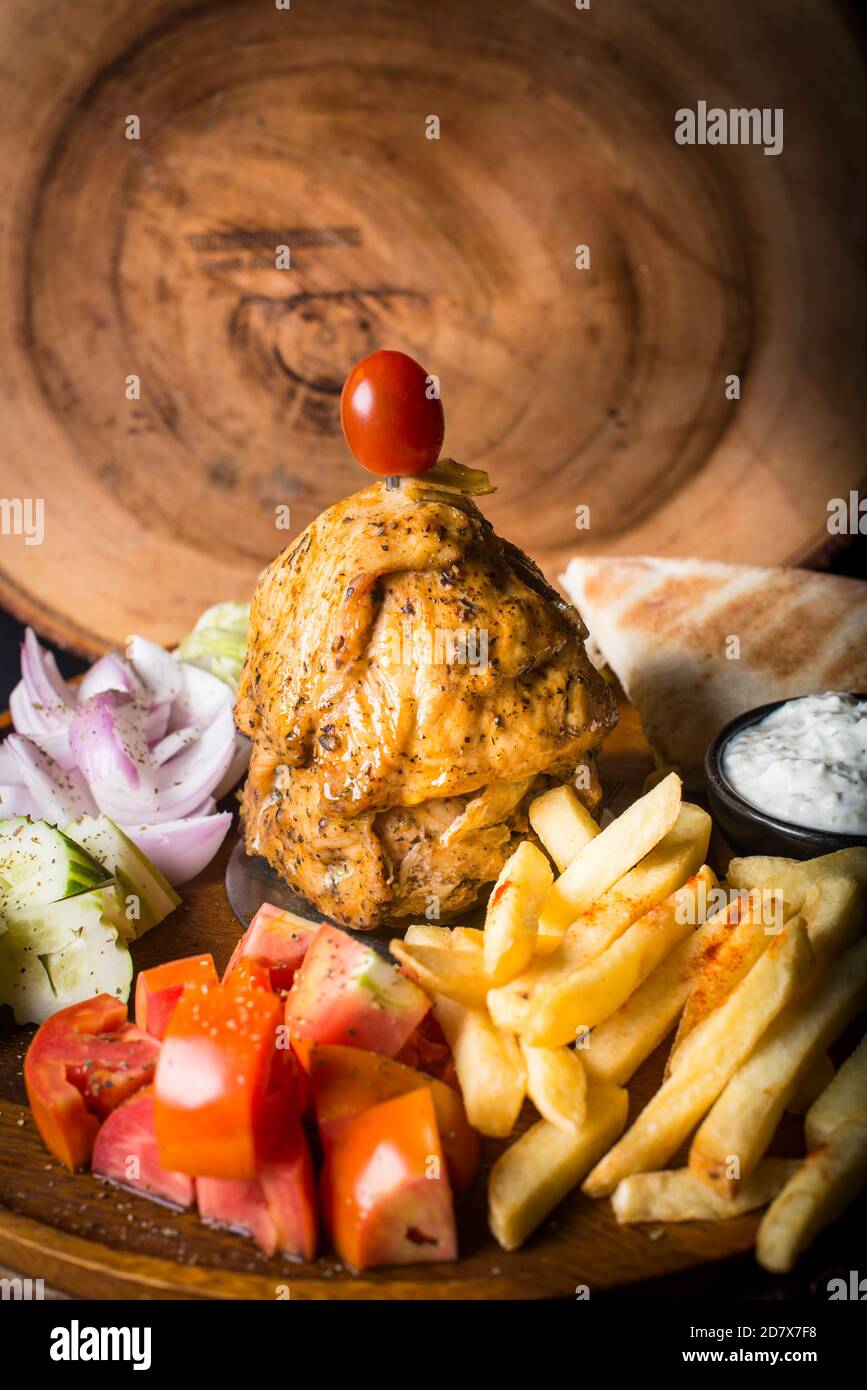 Chicken Gyros kebab served with bread,french fries and salad and ...