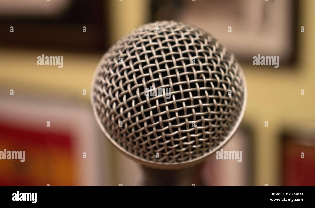 Close up on a metal microphone, with a blurry background Stock Photo ...