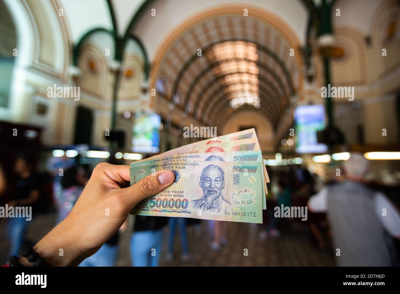 Tourist holding money for exchange in Saigon Central Post Office Stock ...