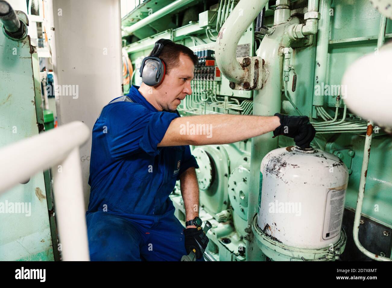 Marine engineer officer controlling vessel enginesand propulsion in ...