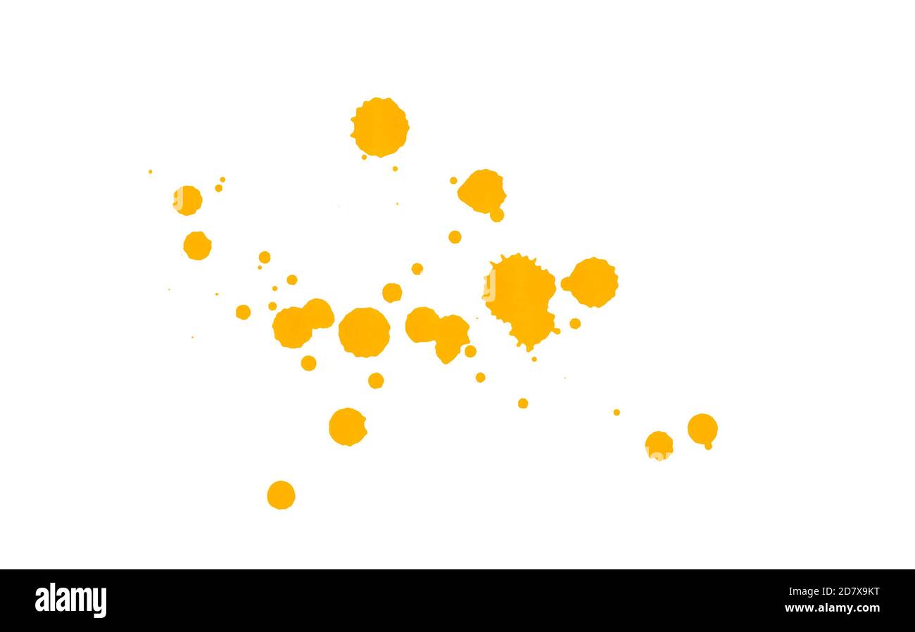 Yellow paint drops isolated on white background Stock Photo - Alamy